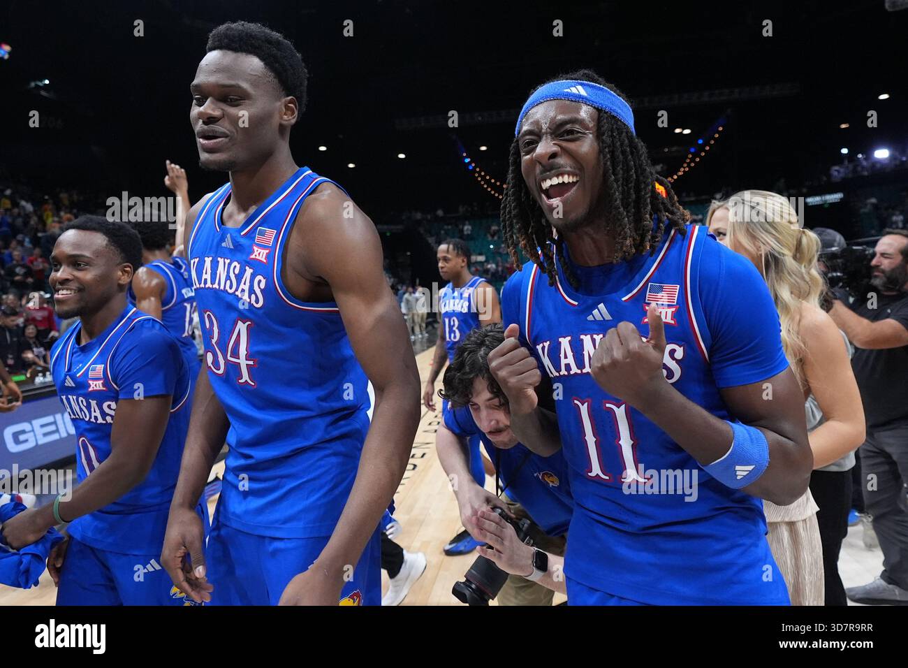 Kansas center Paul Mbiya (34) and guard Jamari McDowell (11) celebrate ...