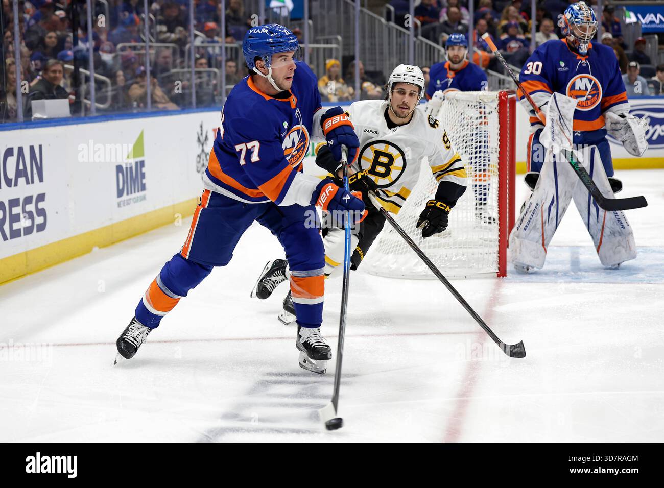 New York Islanders defenseman Tony Deangelo (77) clears the puck in ...