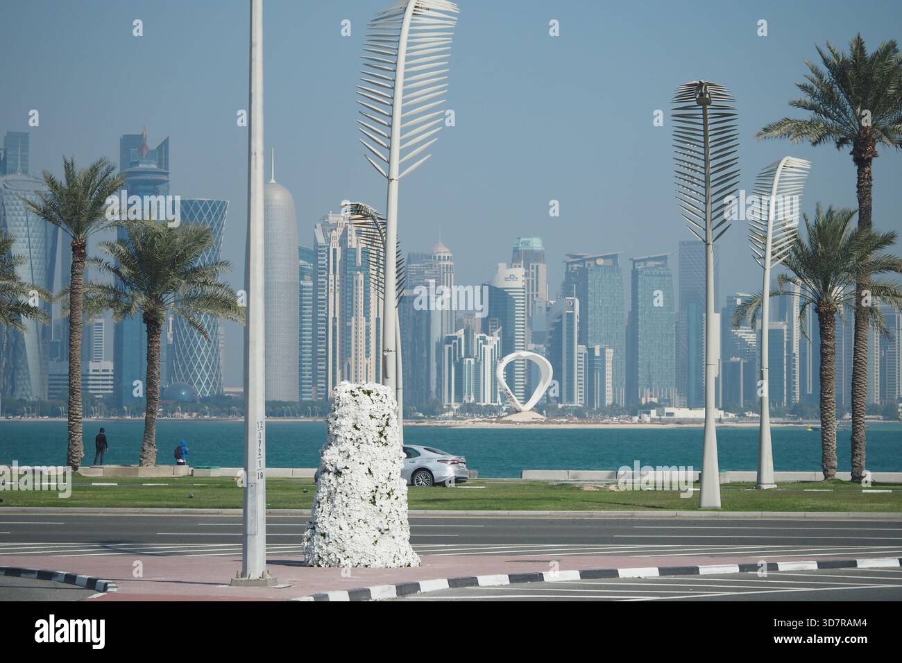 watar doha 2 february 2025. Skyline with palm trees and sculptures by ...