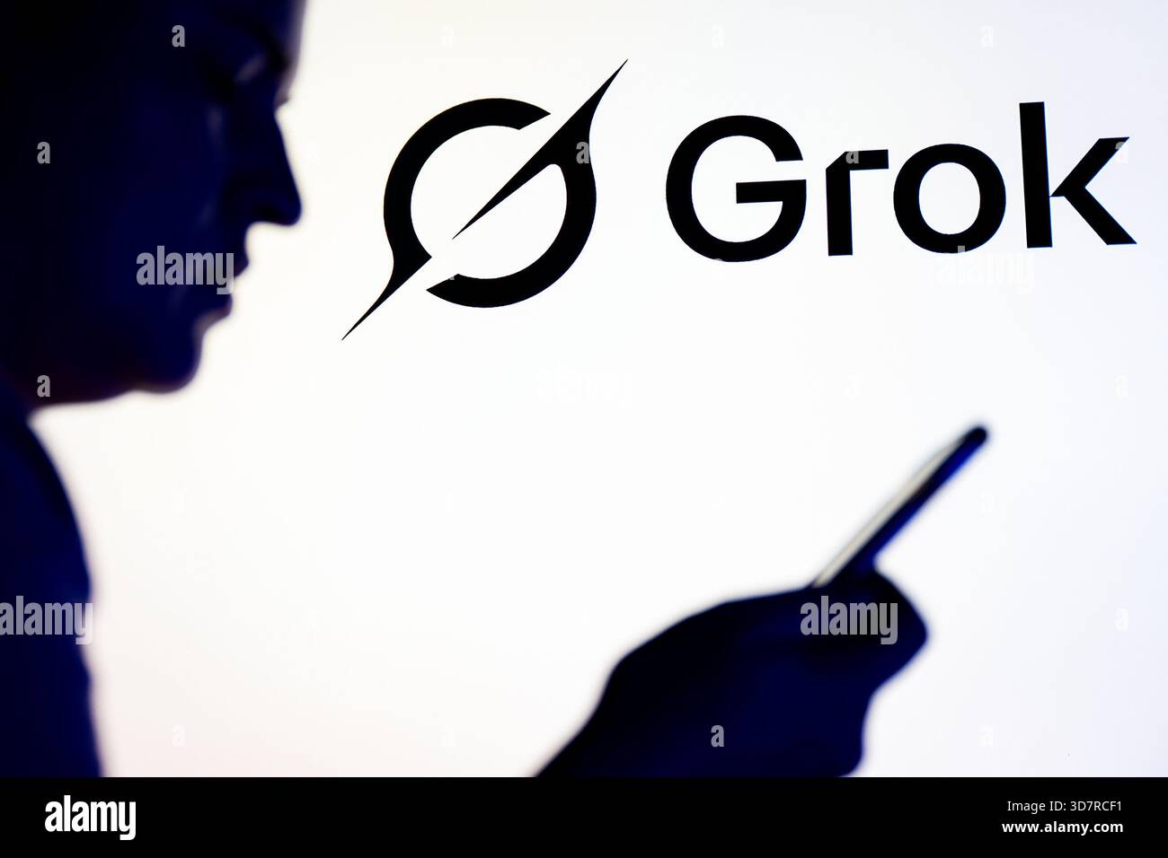 In this photo illustration, the Grok logo is seen displayed on TV ...
