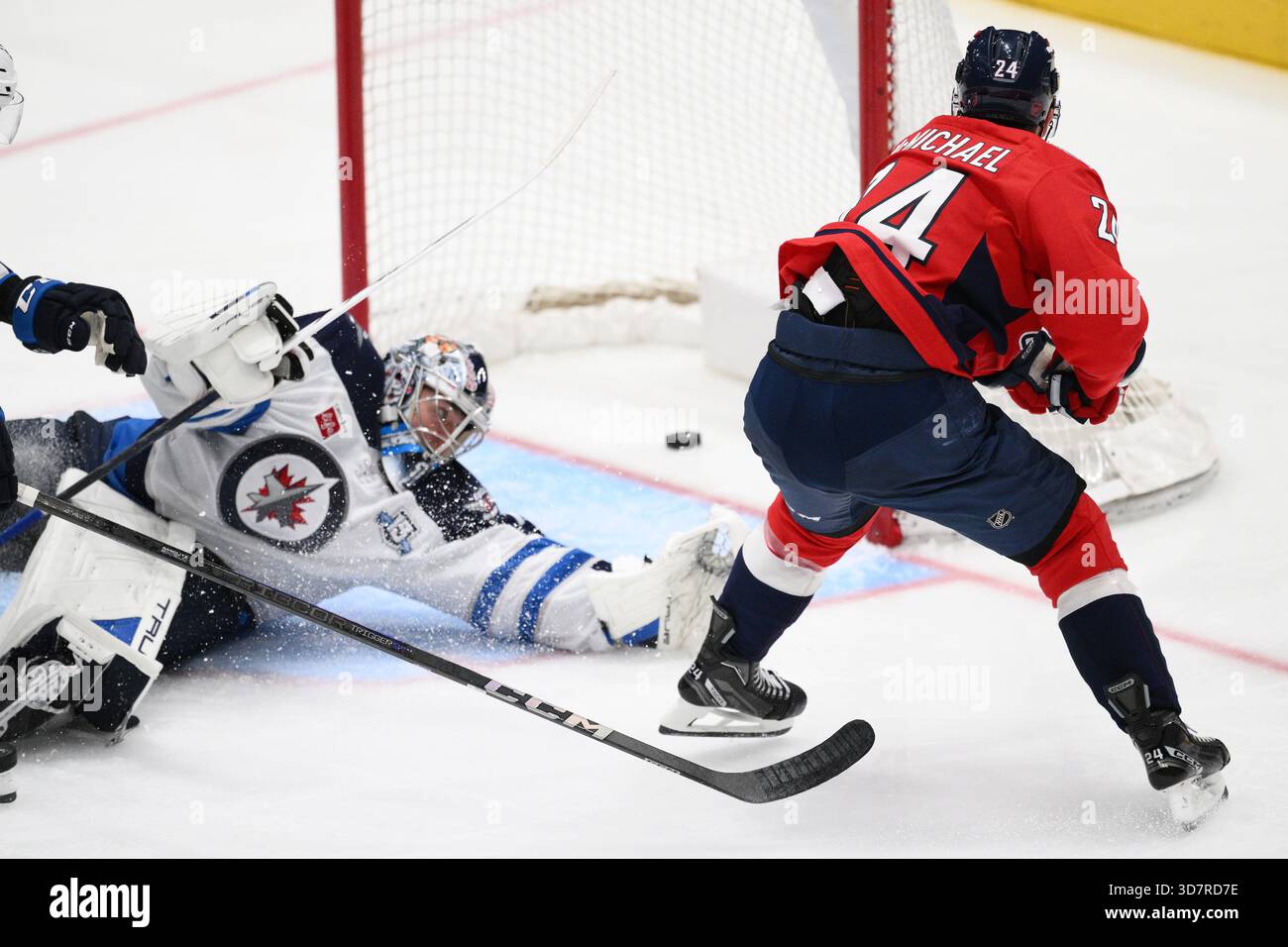 Washington Capitals center Connor McMichael (24) scores a goal past ...