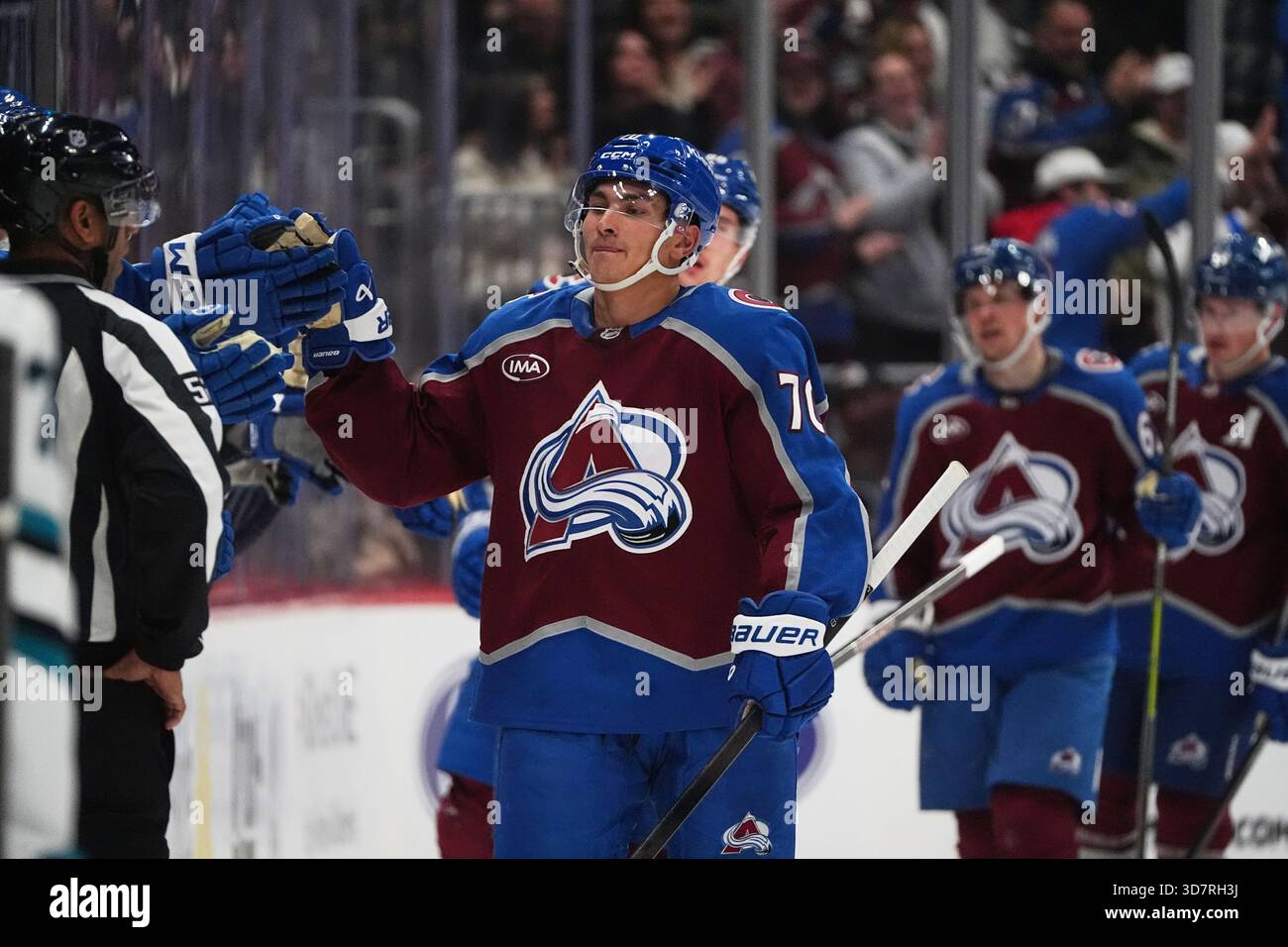 Colorado Avalanche defenseman Sam Malinski is congratulated as he ...