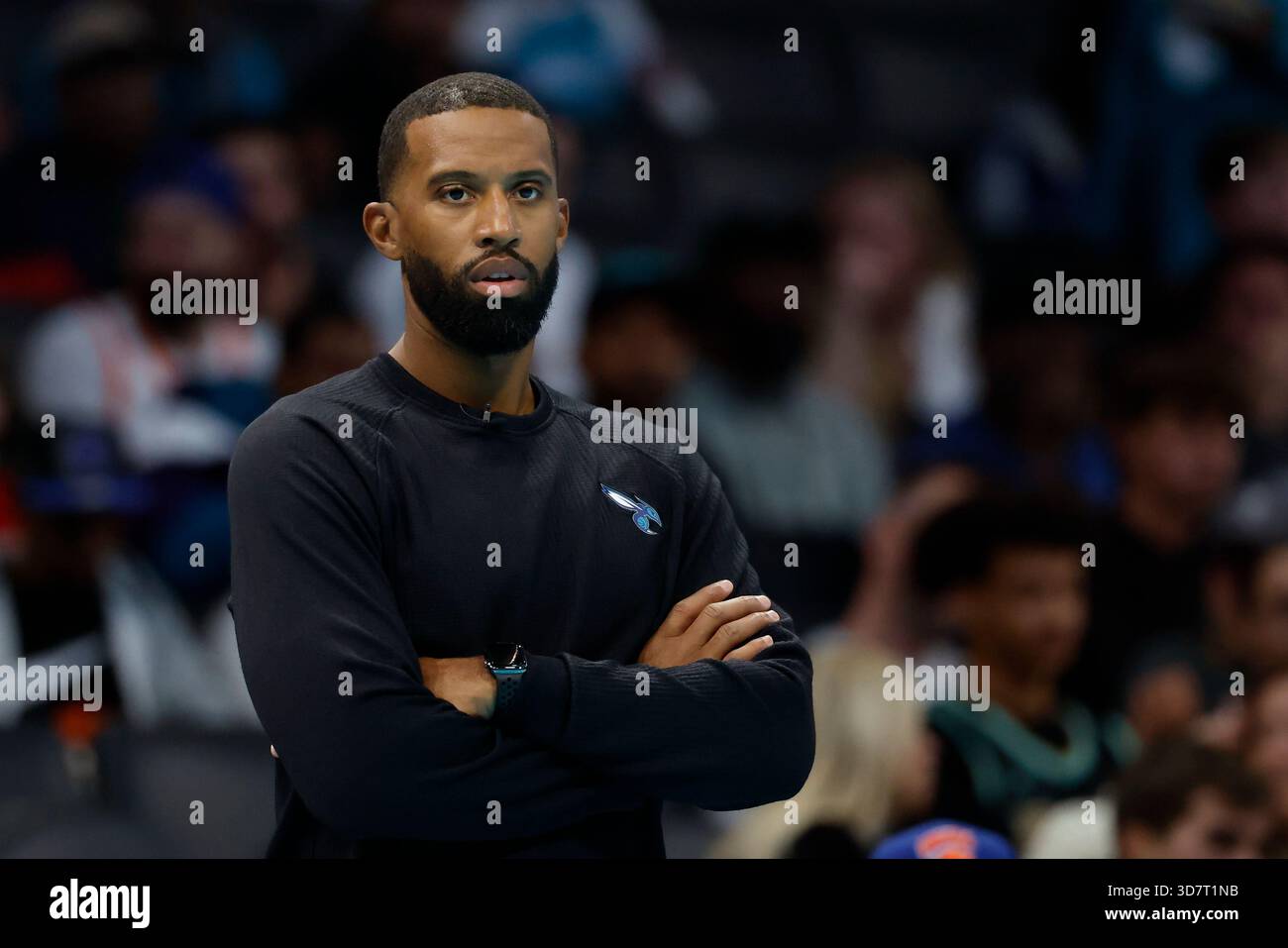 Charlotte Hornets head coach Charles Lee watches as the Hornets play ...