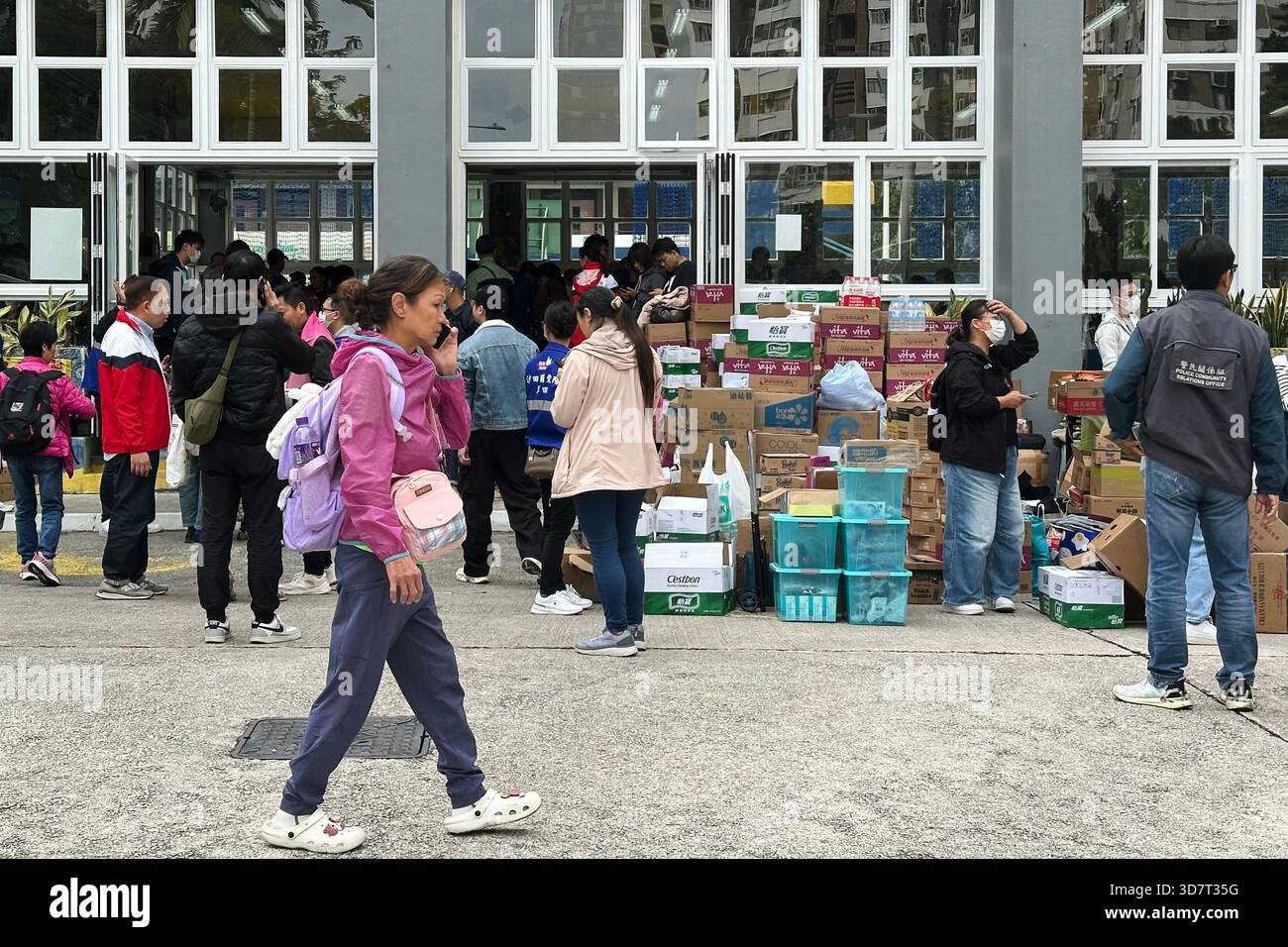 Evacuated people walk around at Church of Christ in China Fung Leung ...