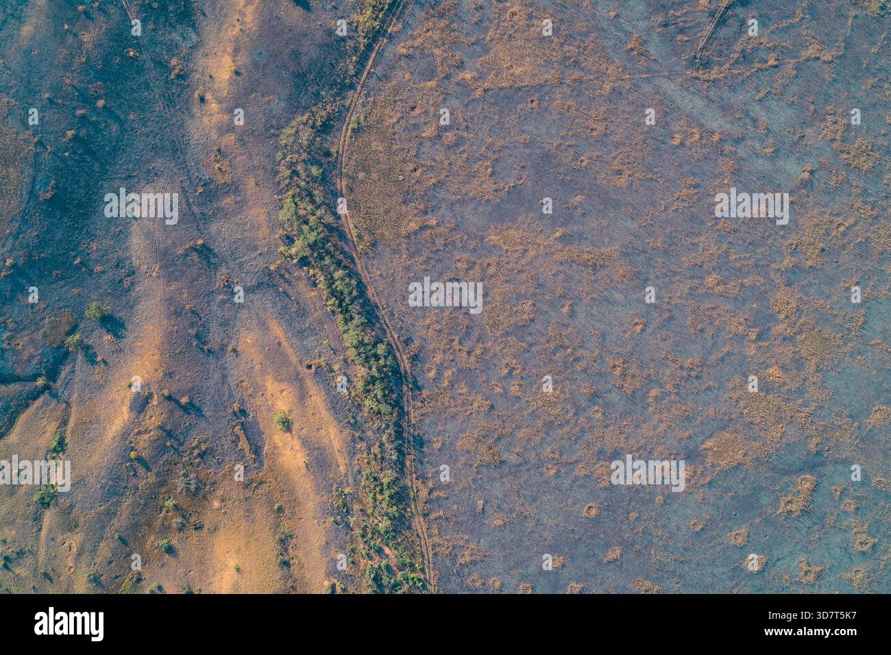Aerial abstract close-up of dry, scorched earth showing an organic ...