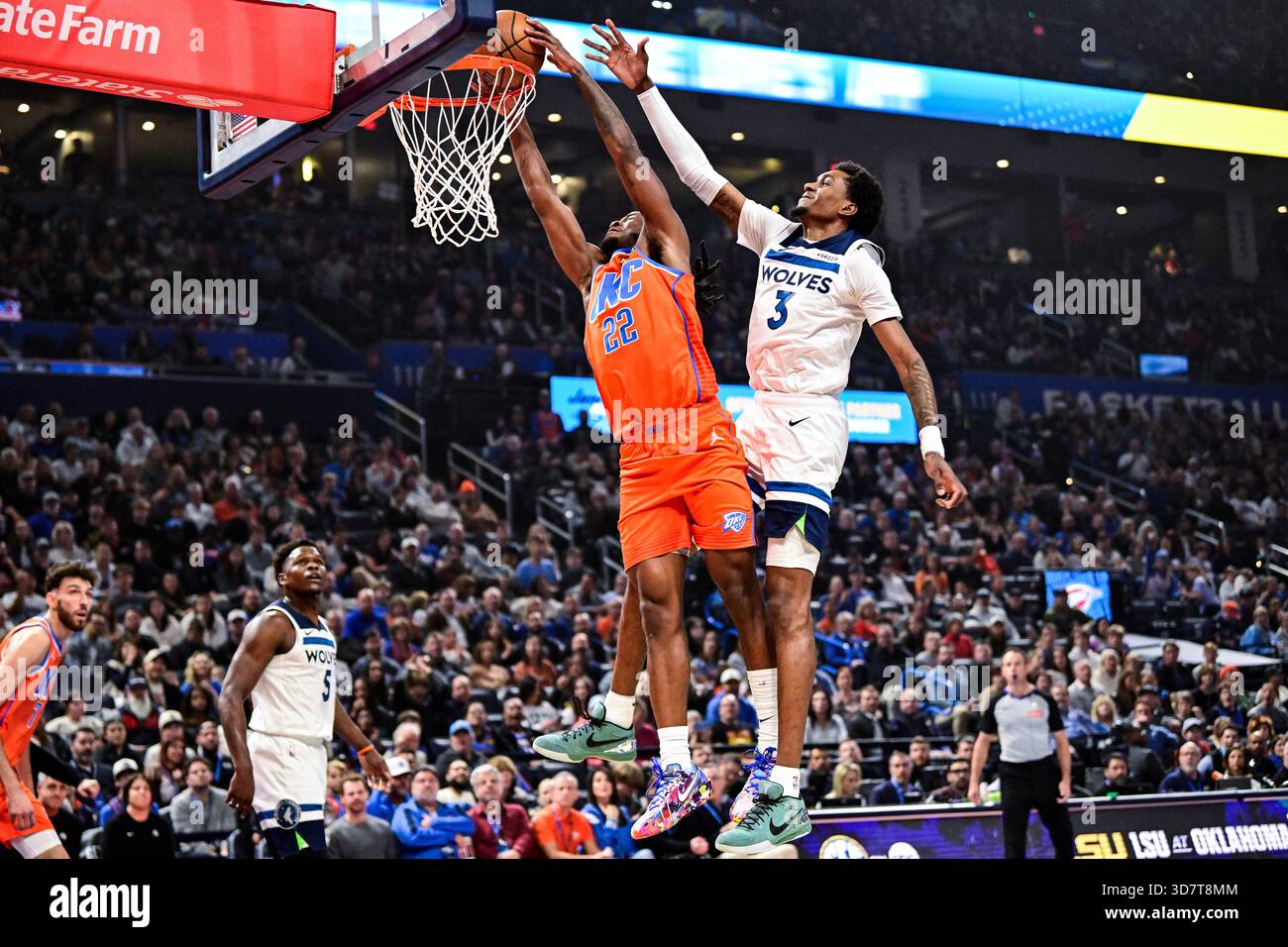 Oklahoma City Thunder guard Cason Wallace (22) shoots against Minnesota Timberwolves forward ...