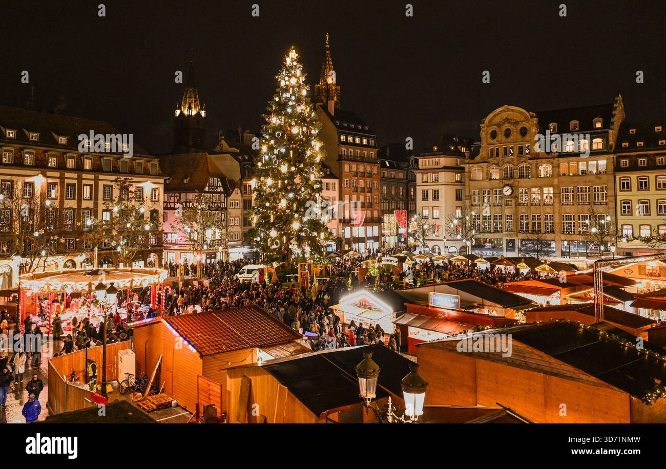 People stroll at a Christmas market in Strasbourg, eastern France ...