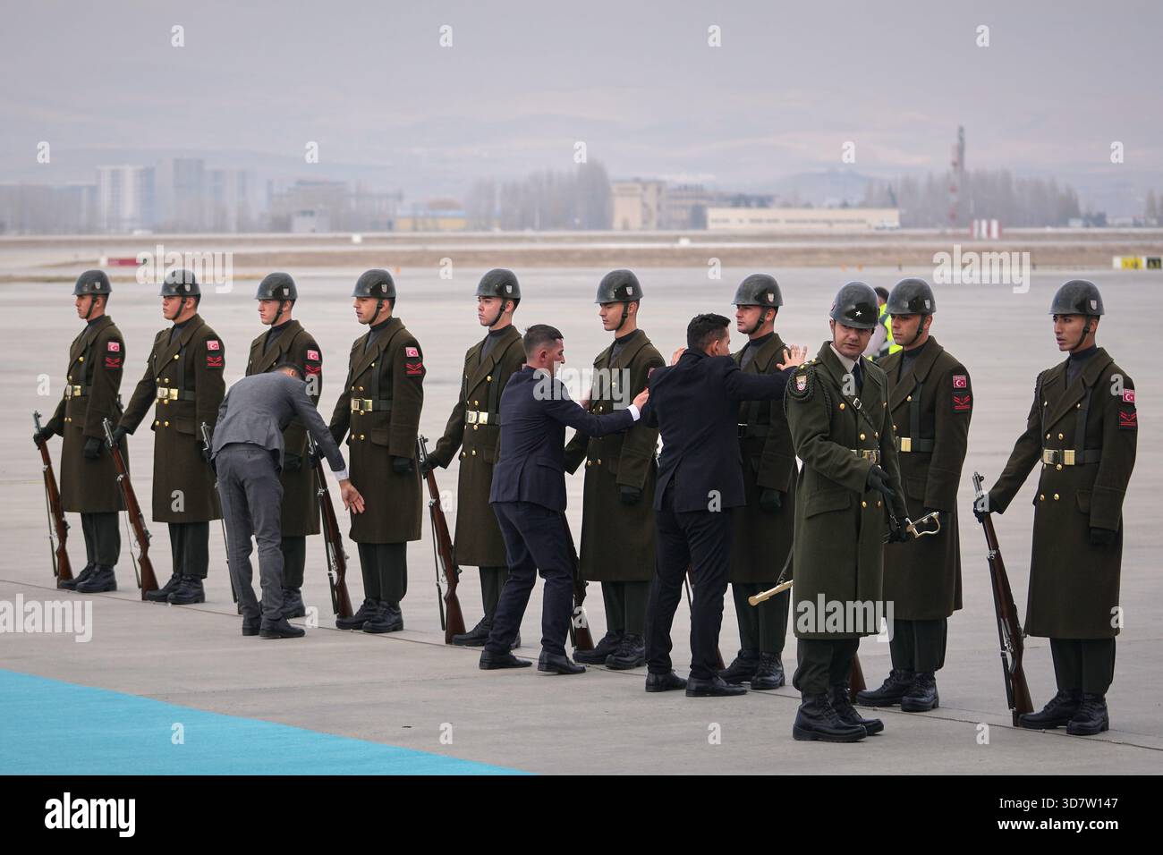 A Turkish honor guard prepares ahead of the arrival of the papal plane ...