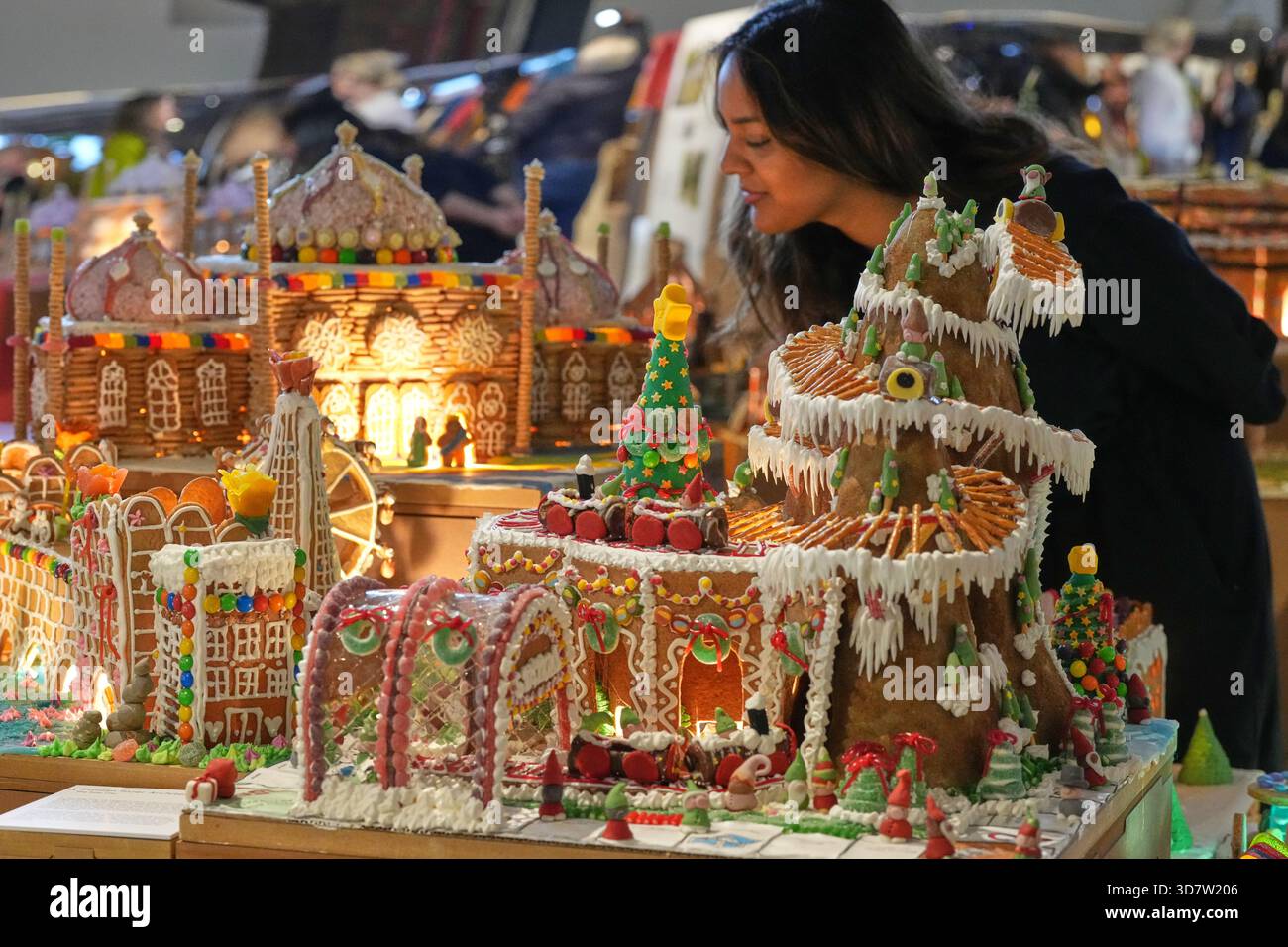 A woman looks at buildings made of gingerbread at the exhibition 'The ...