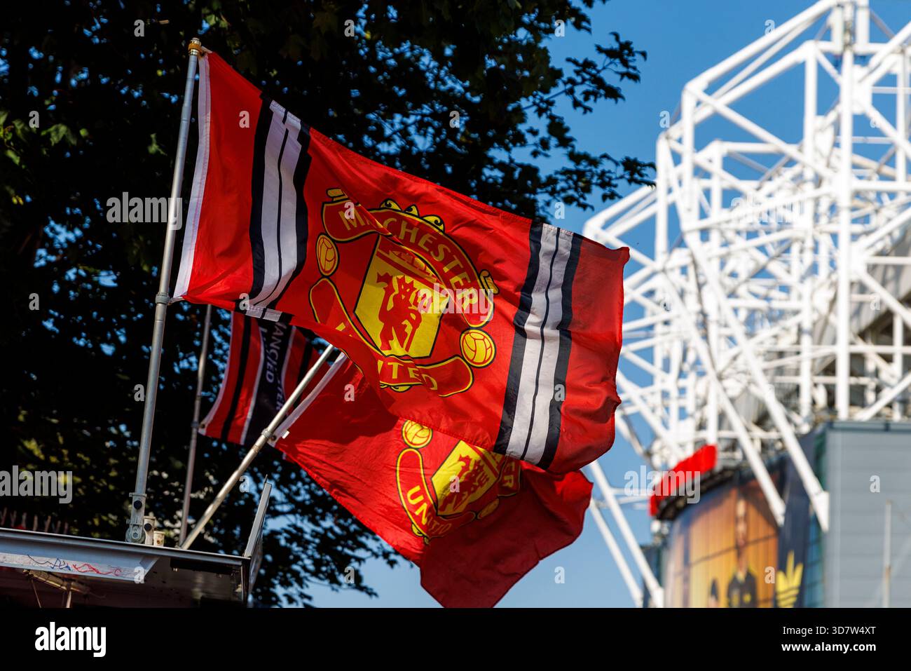 Manchester, England - 17.08.2025: Red Manchester United flags waving ...