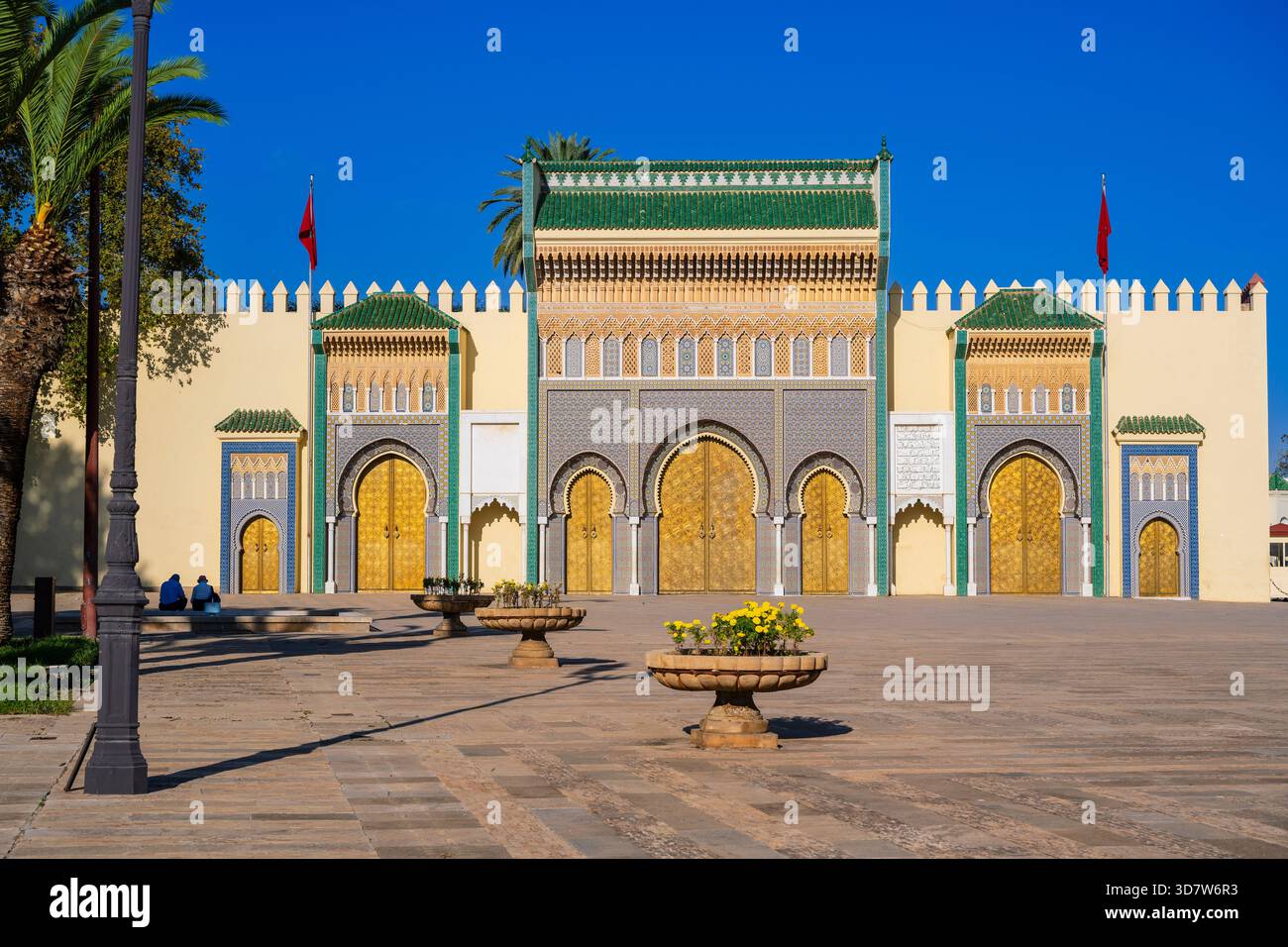 Ornate palace with golden doors and detailed mosaic against a clear ...