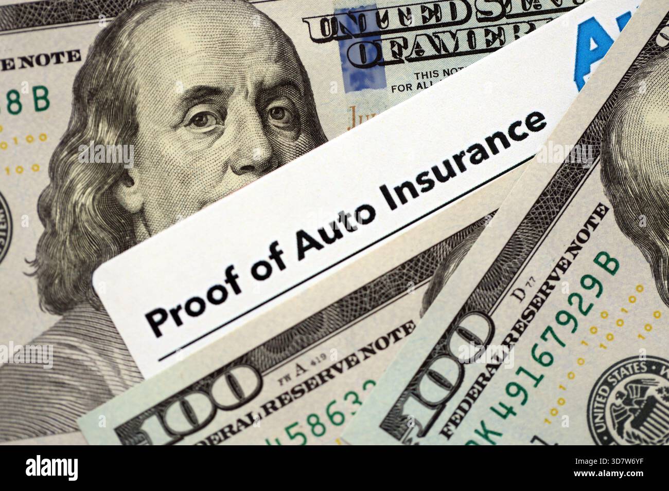 Proof of auto insurance card and many hundred dollar bills. Concept of ...