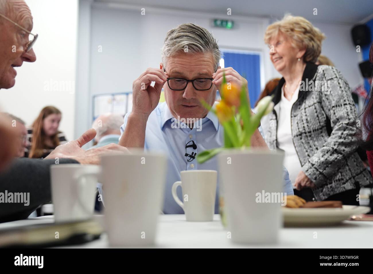 British Prime Minister Sir Keir Starmer adjusts his glasses as he ...
