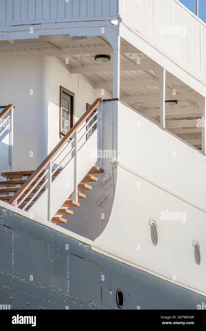 Detail of the side of a classic ship showing the exterior wooden stairs ...
