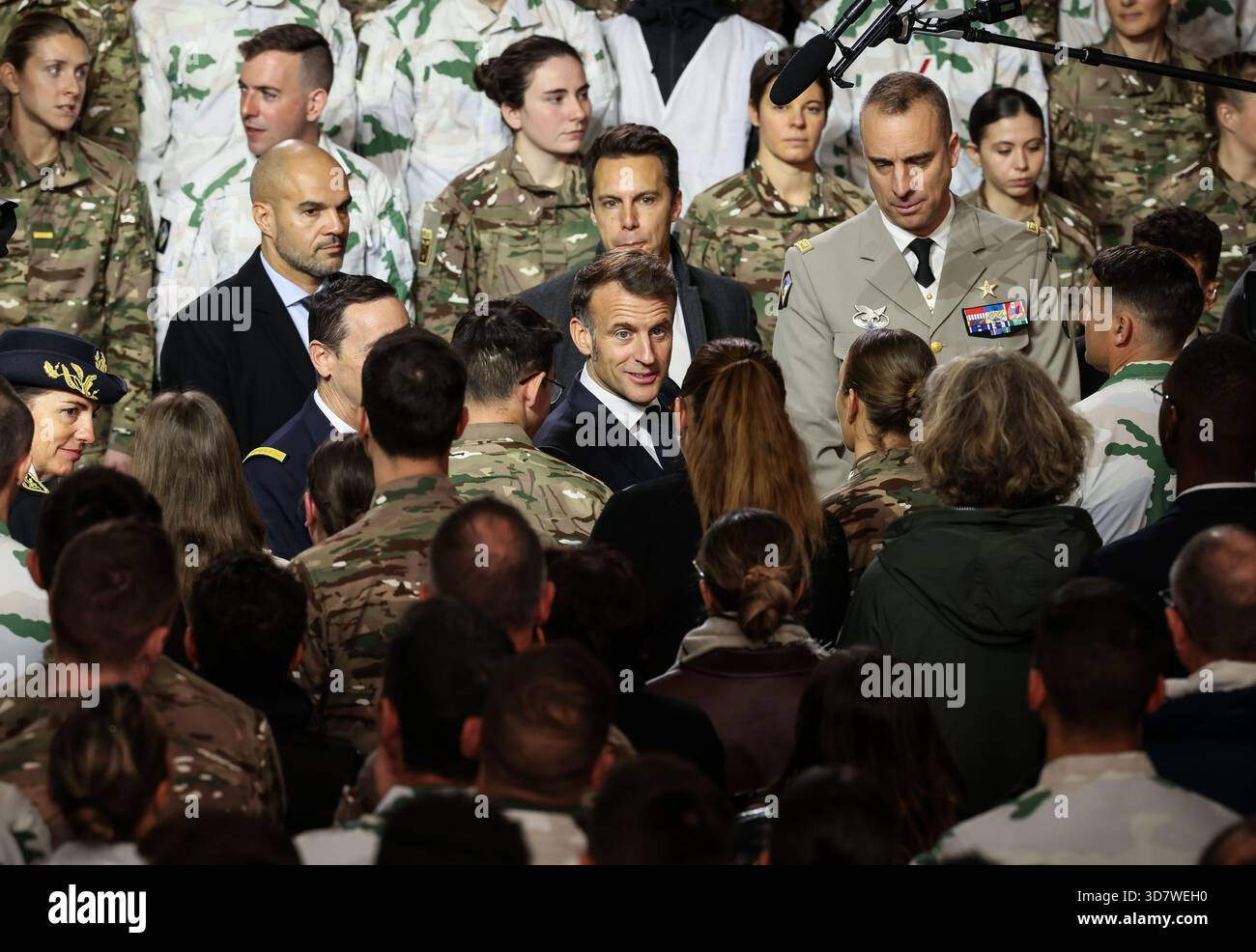 France's President Emmanuel Macron meets members of the military after unveiling a new national ...