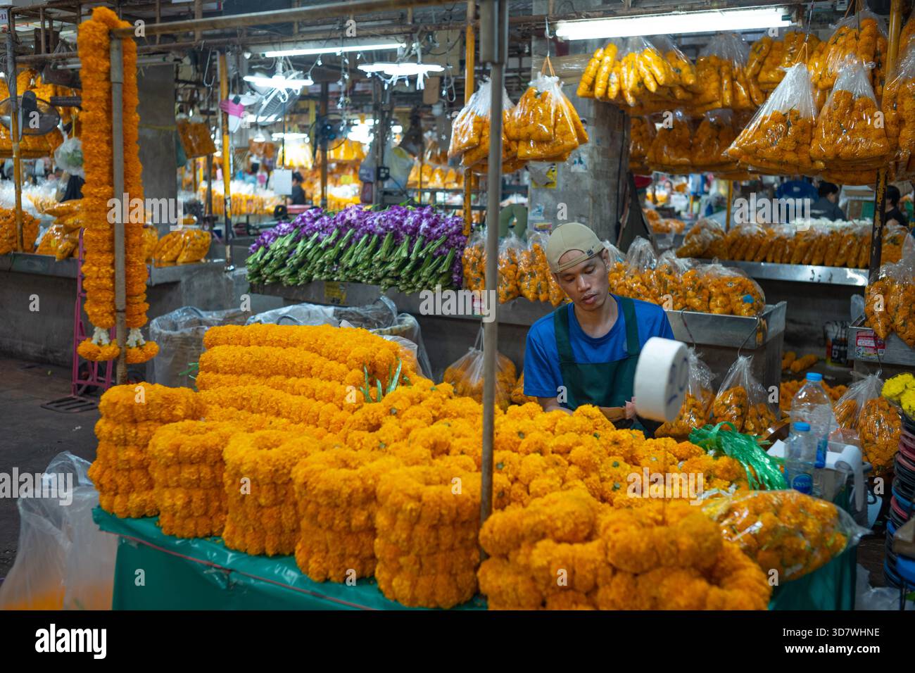 A flower booth with piles of chrysanthemums at the flower market in ...
