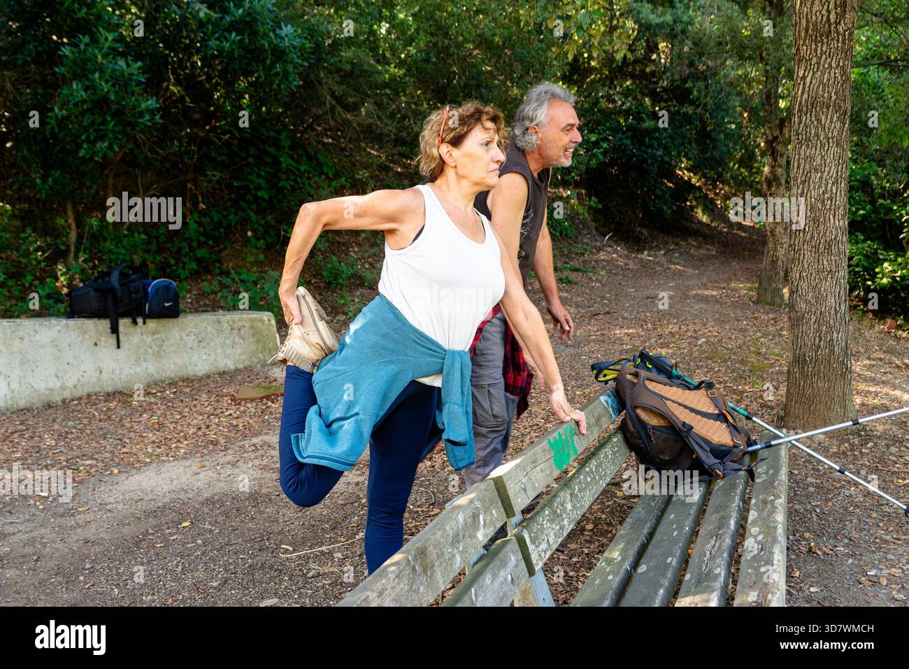 Woman stretching before trail hi-res stock photography and images - Alamy