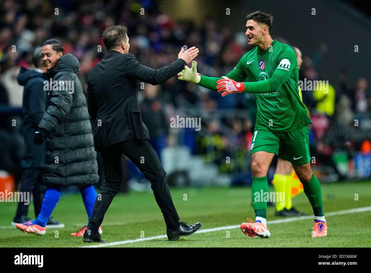 Juan Musso of Atletico de Madrid and Diego Simeone head coach of ...