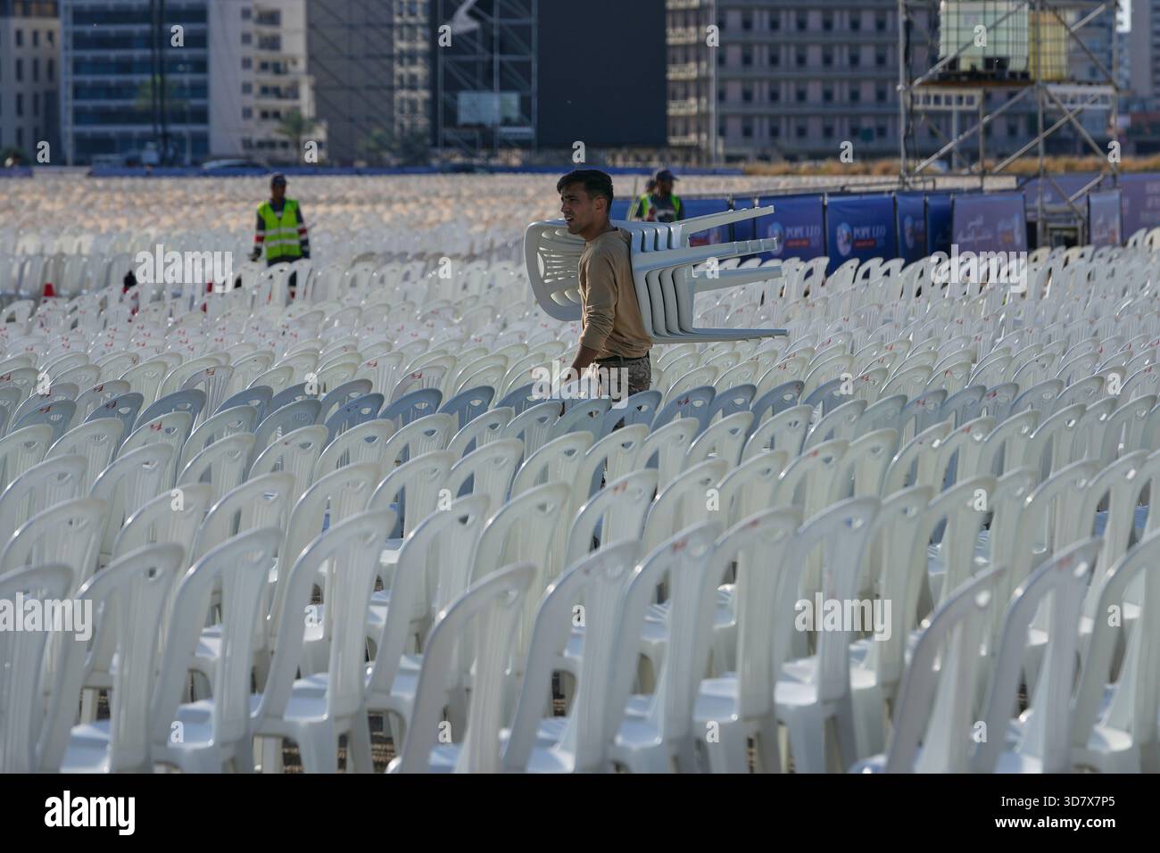 A Lebanese army soldier carries chairs to be set in preparation of the ...