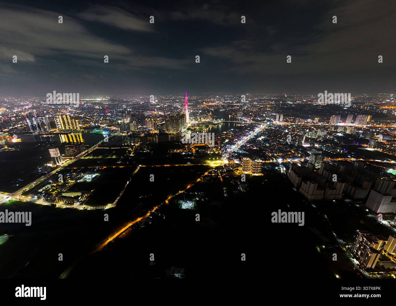 A city at night with many lights on. The lights are on in the sky and ...