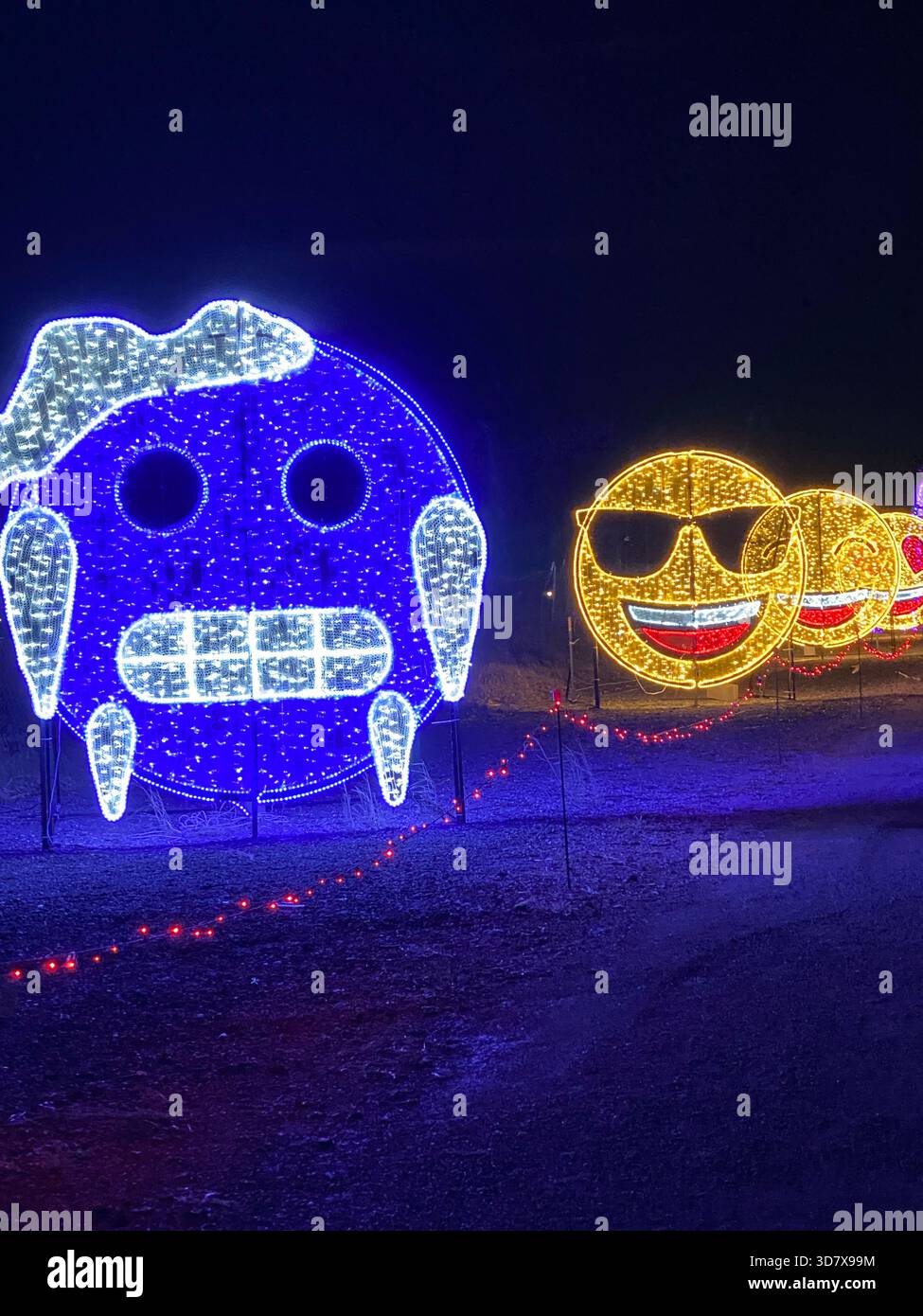 Four six foot tall smiley face emojis, and a freezing face emoji, with ...