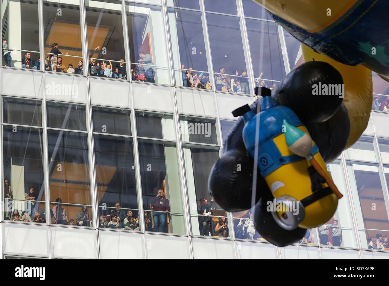 The Minions float passes as people watch the Macy's Thanksgiving Day ...