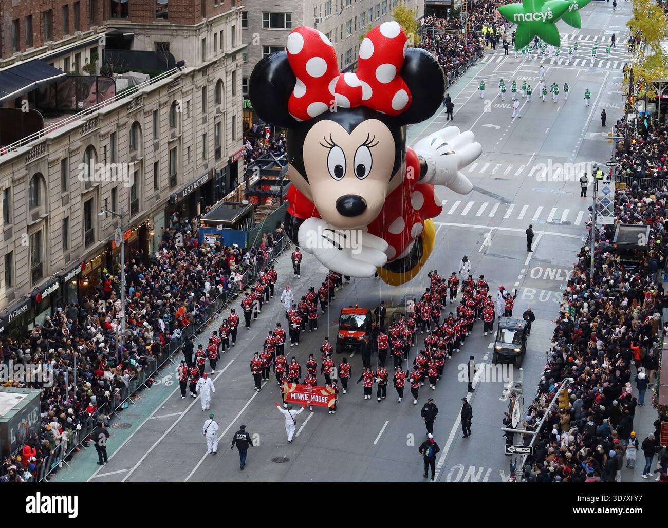 The Disney Minnie Mouse balloon makes its way down the parade route as ...