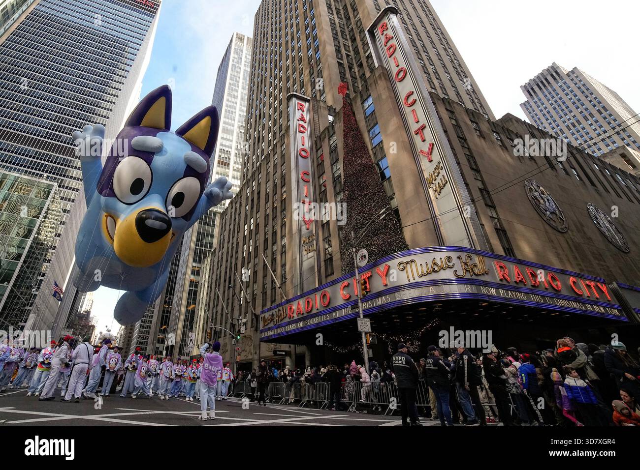 The Bluey balloon floats down Sixth Avenue during the Macy's ...