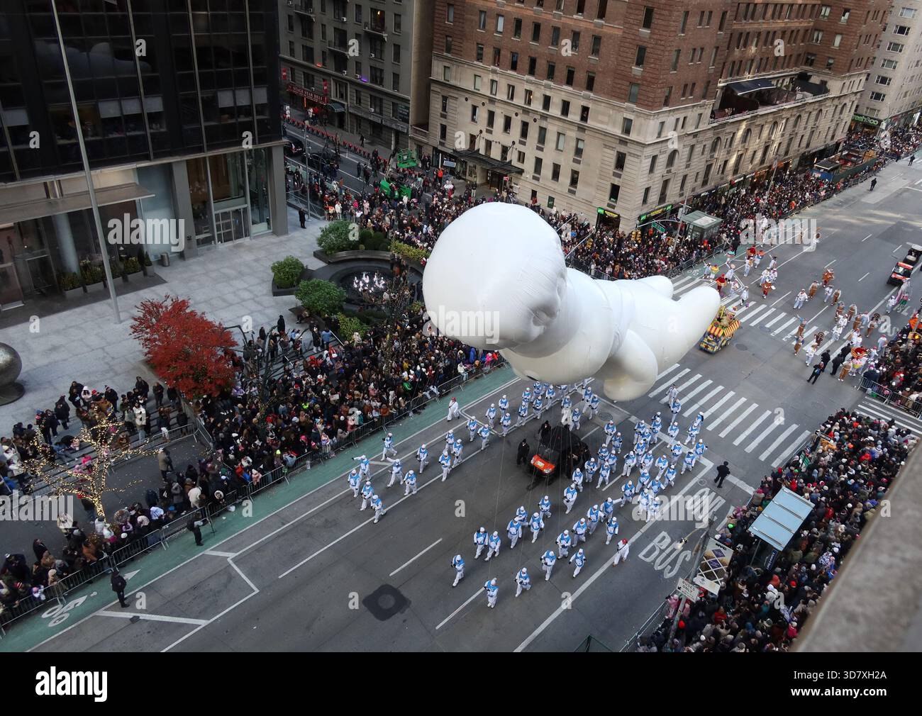 The Pillsbury Doughboy balloon makes its way down the parade route as ...