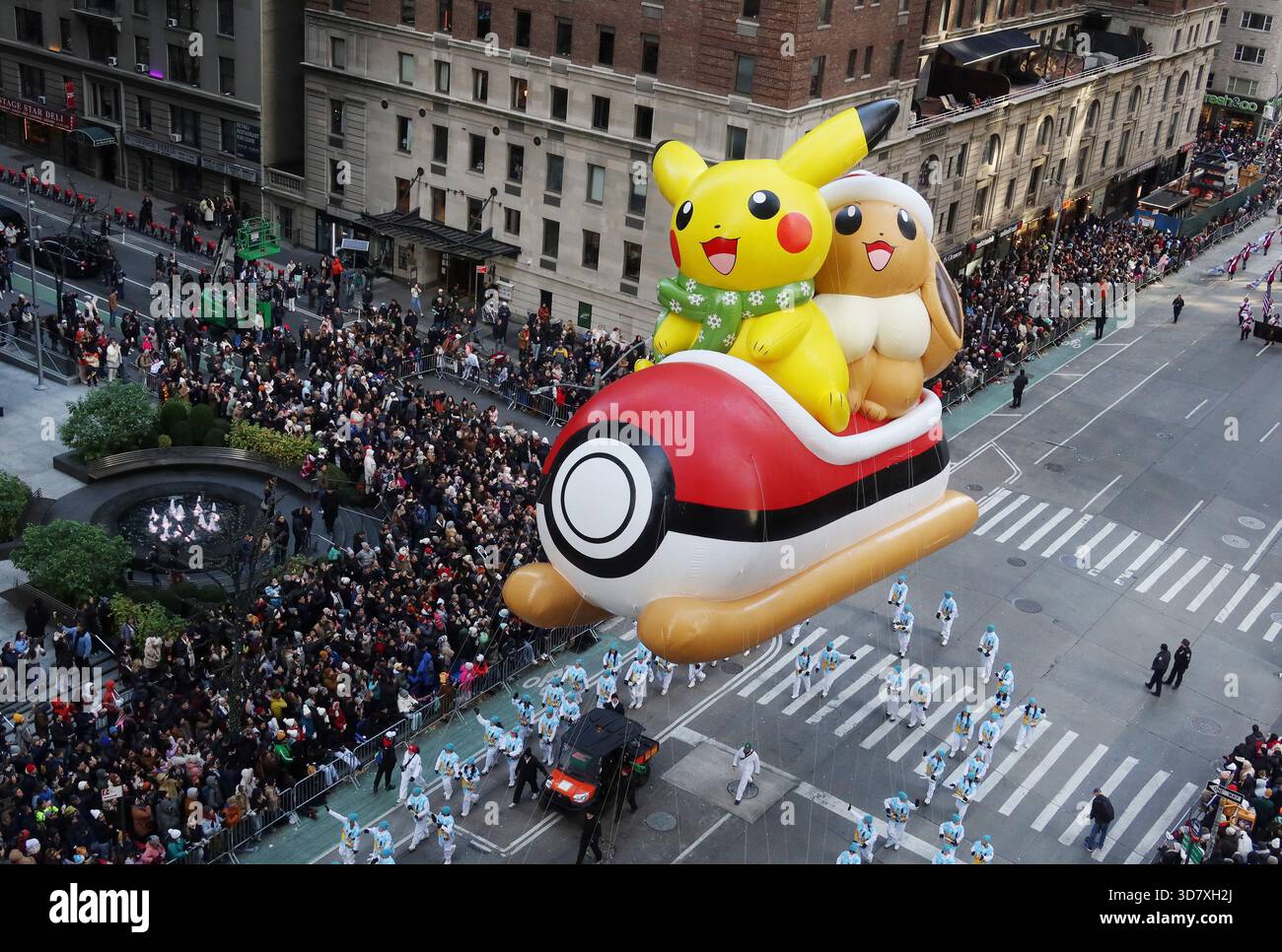 The Pikachu and Eevee balloon makes its way down the parade route as ...