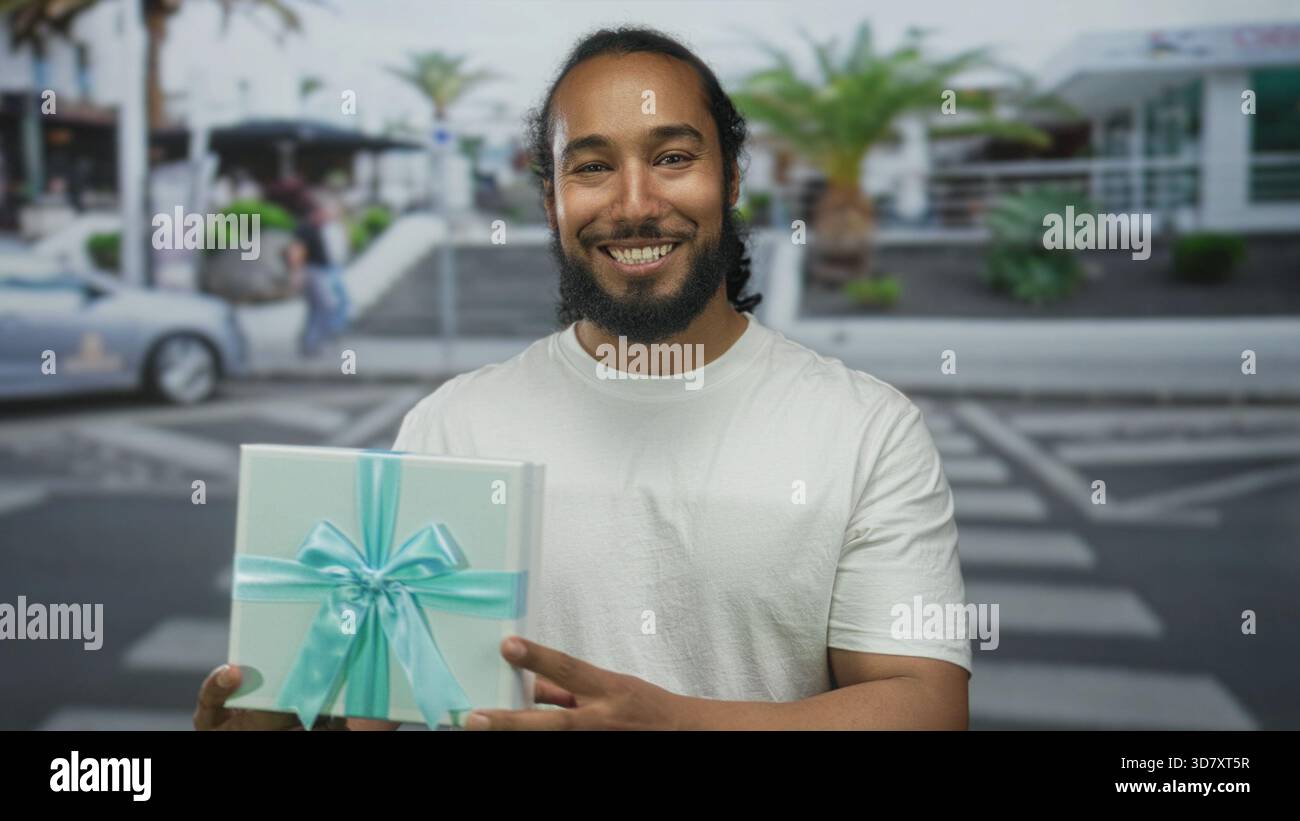 Man holding teal gift box hi-res stock photography and images - Alamy