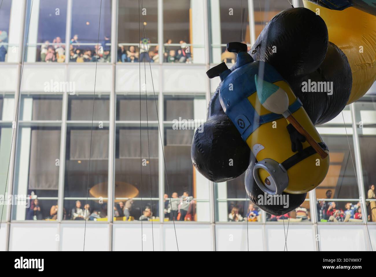 The Minions float passes as people watch the Macy's Thanksgiving Day ...