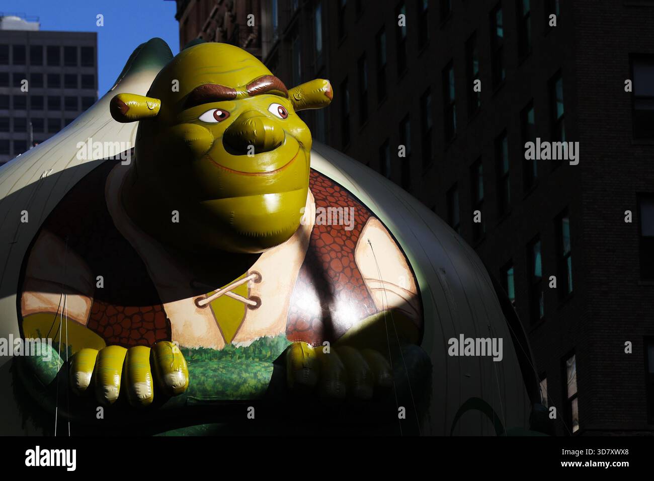 The Shrek balloon makes its way down Sixth Avenue during the Macy's ...