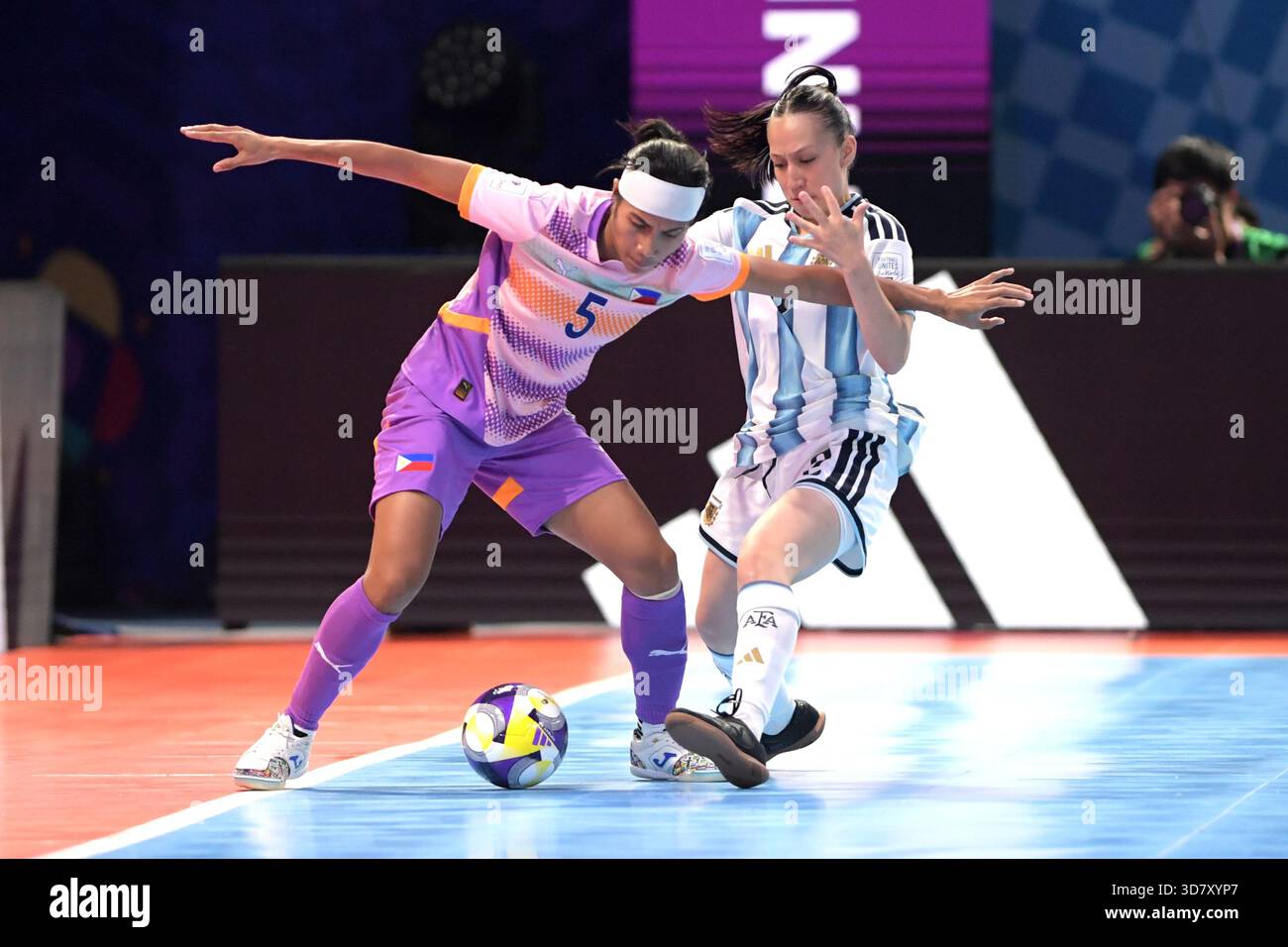 Dionesa Tolentin (L) of Philippine Women Futsal team and Macarena Aylen ...