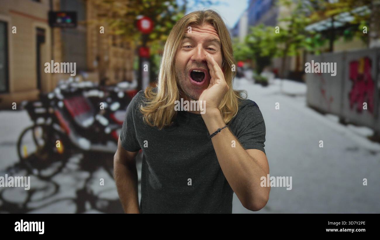 Man standing shouting through cupped hands revealing open mouth on ...