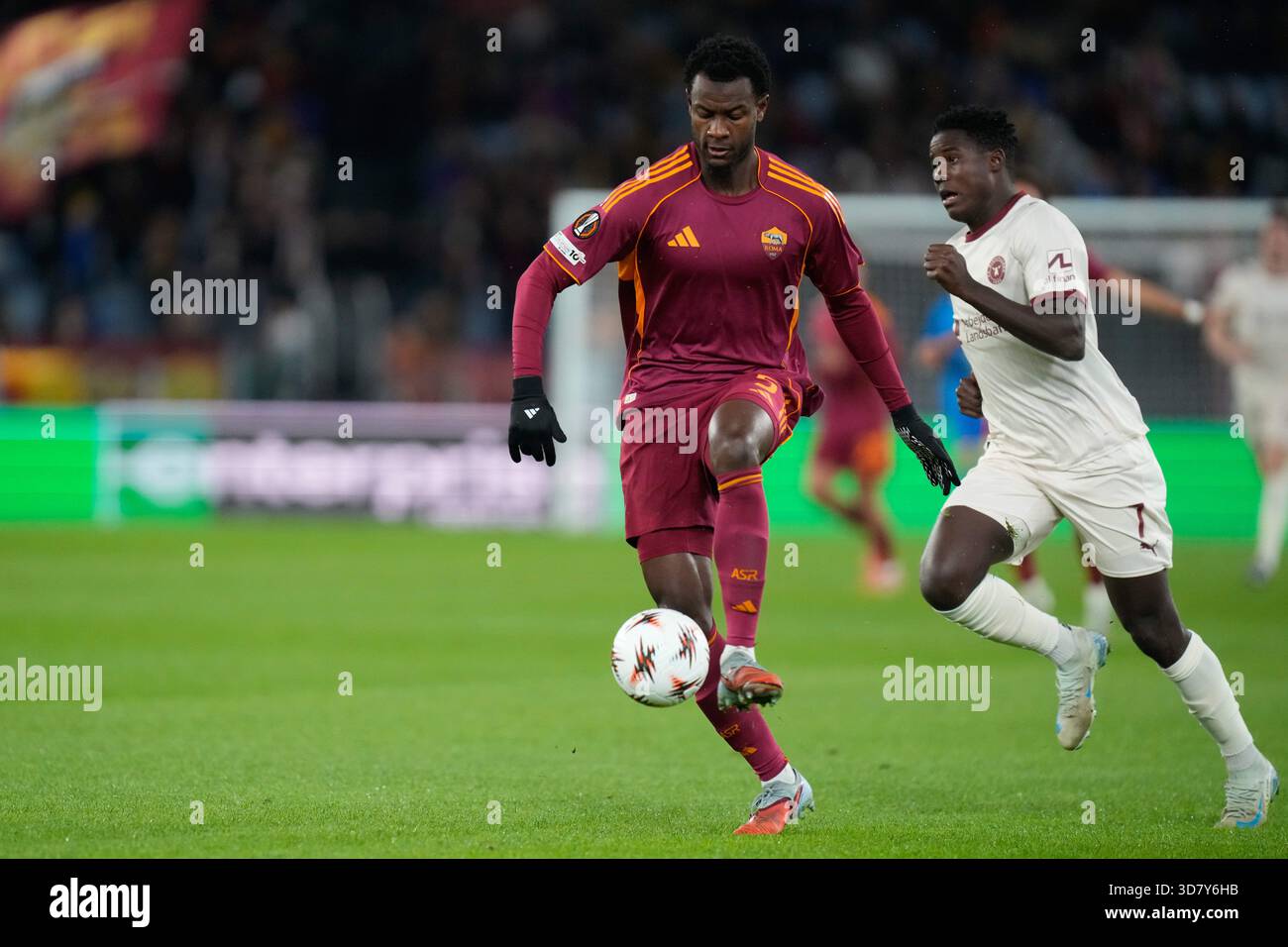 Roma's Devyne Rensch, left and Midtjylland's Franculino Dju challenge ...