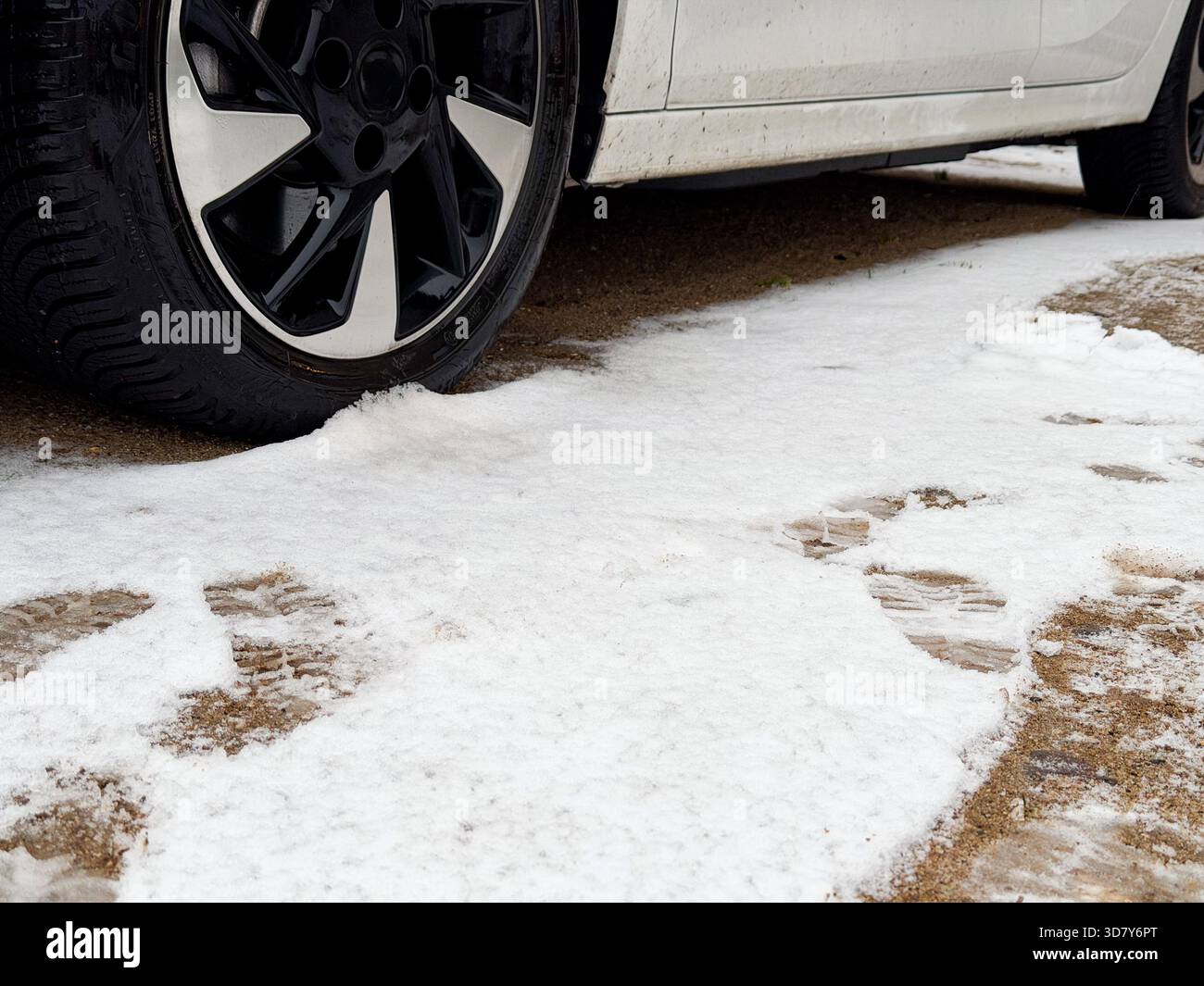 Front car wheel of a car on snow ground Stock Photo - Alamy