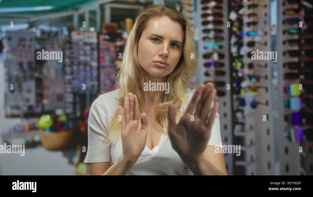 Woman making dismissive gesture outdoors hi-res stock photography and ...