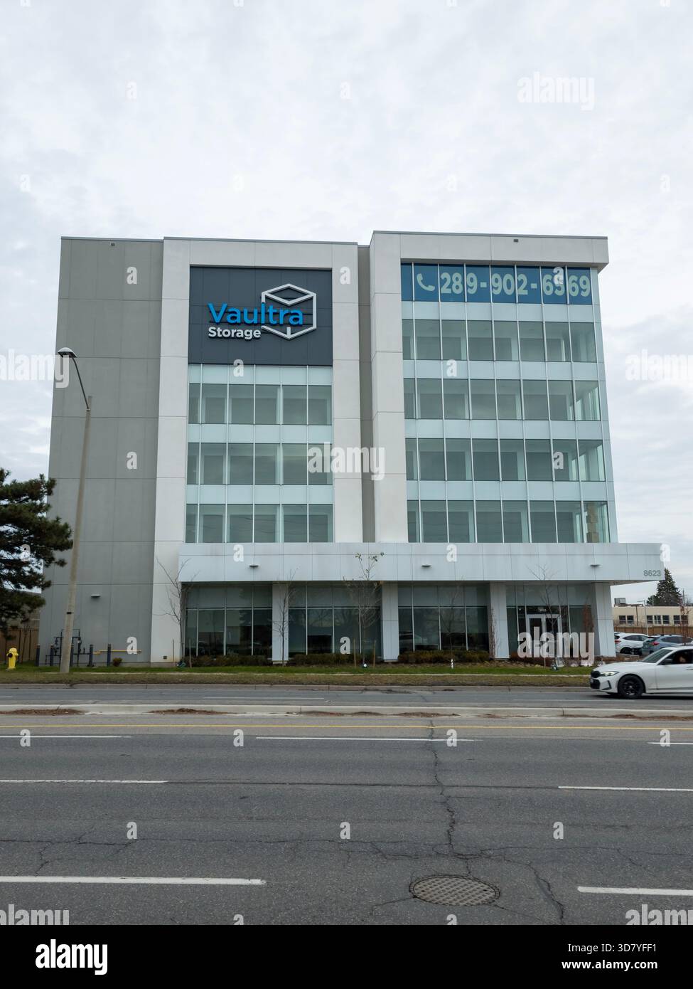 Vaulttra Storage building with glass facade, signage, contact number ...