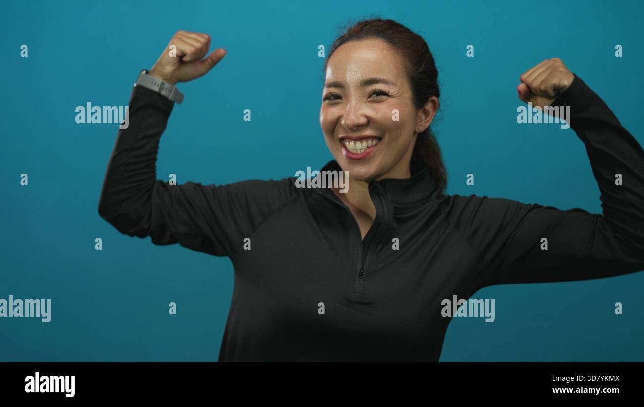 Woman raises arms flex hi-res stock photography and images - Alamy