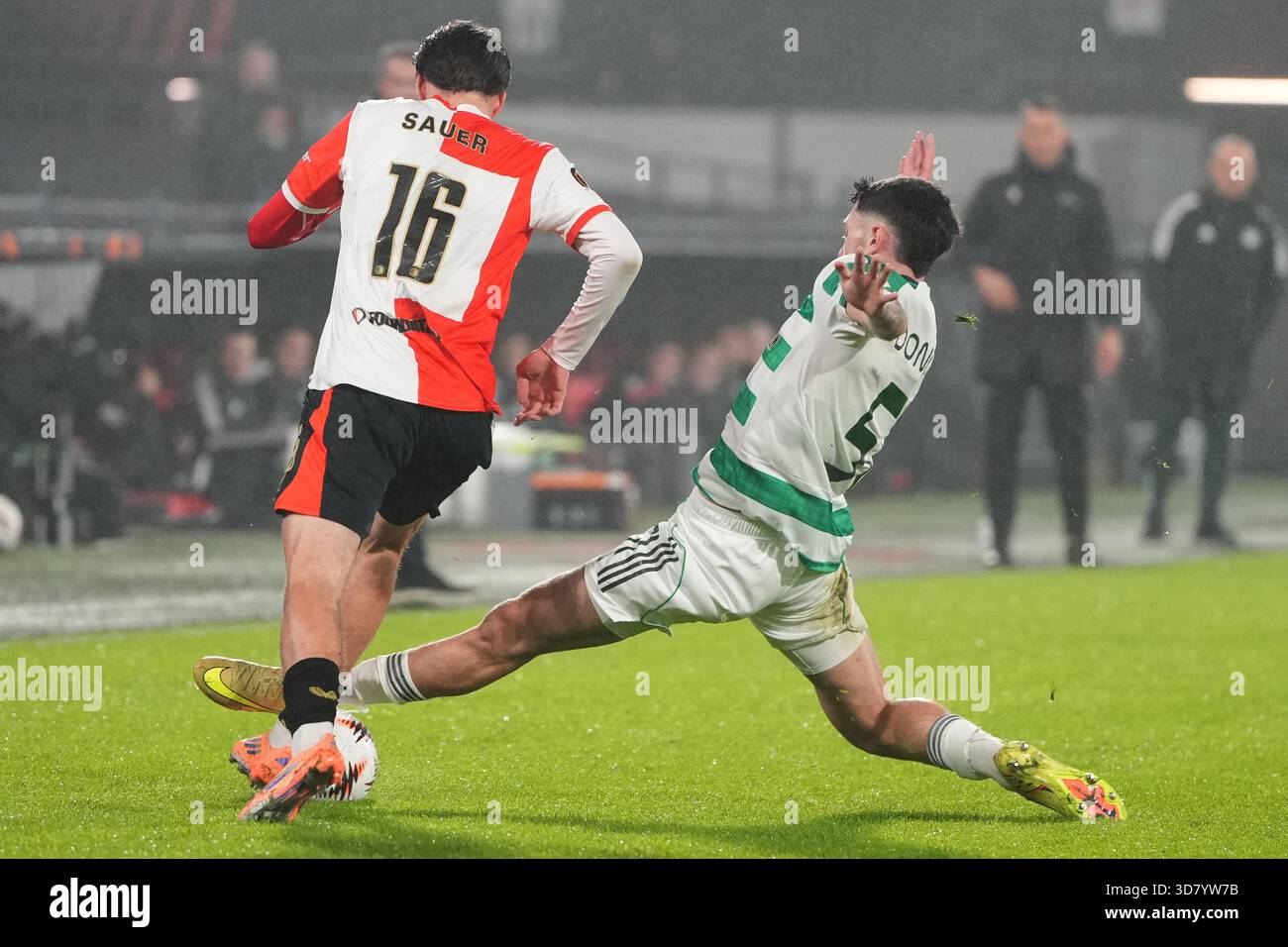 Celtic's Colby Donovan makes a sliding to stop Feyenoord's Leo Sauer ...