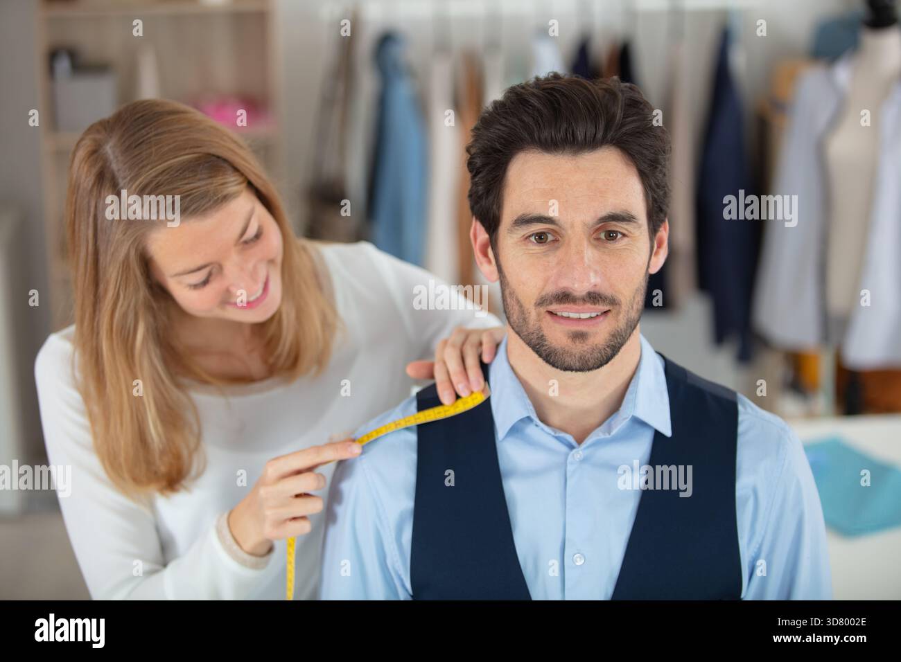 professional tailor taking measurements for formal suit Stock Photo - Alamy