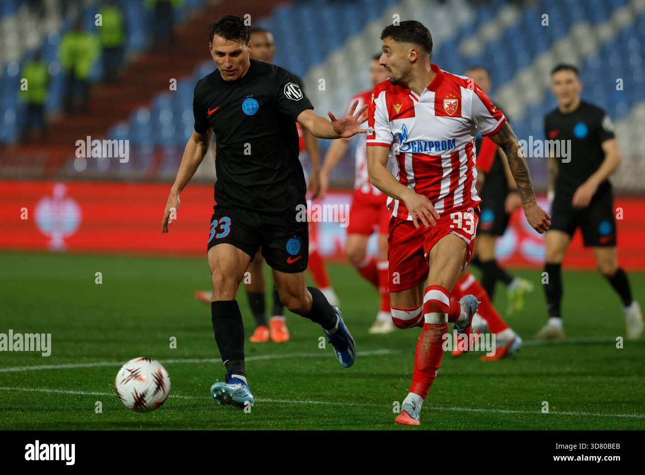 FCSB's Risto Radunovic, left, and Red Star's Rade Krunic, right ...