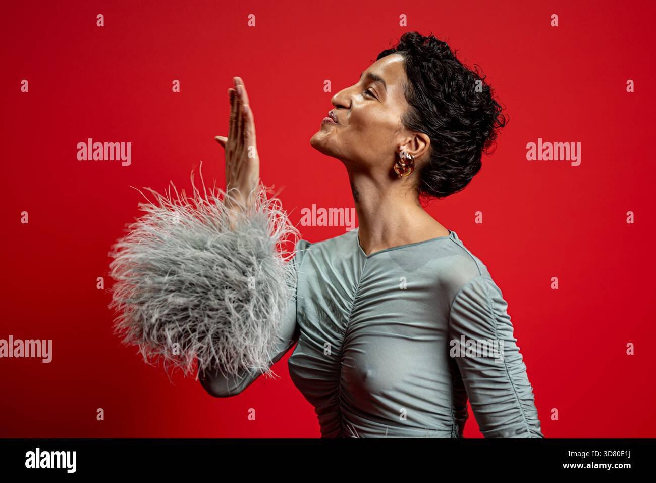 27 November 2025, Berlin: Indya Moore, model, stands on the red carpet ...