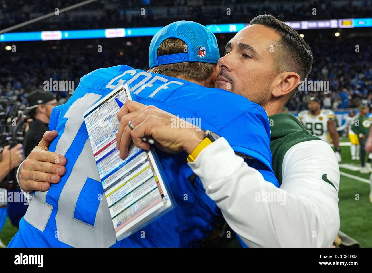 Detroit Lions quarterback Jared Goff (16) hugs Green Bay Packers head ...