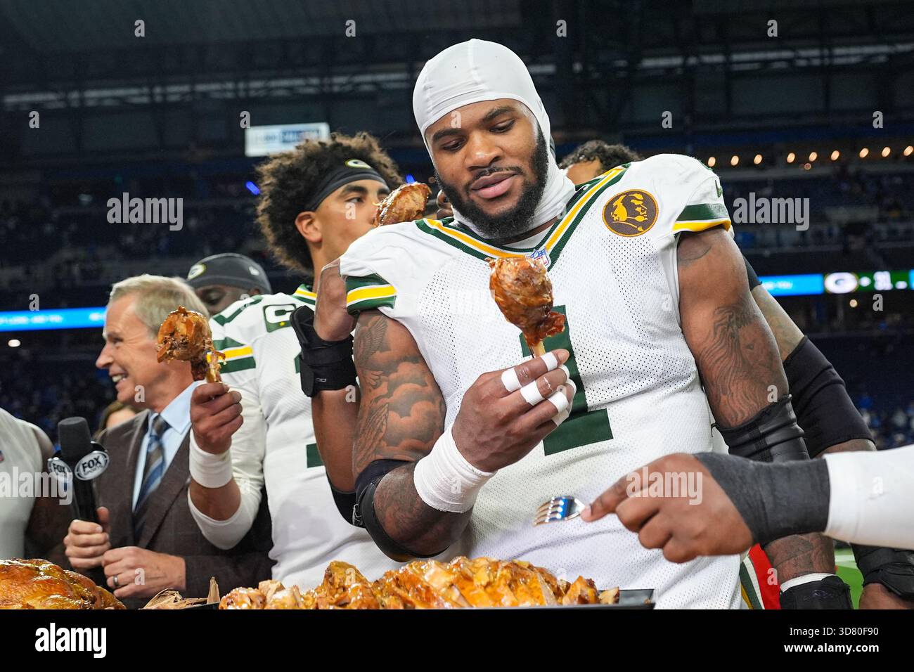 Green Bay Packers defensive lineman Micah Parsons (1) grabs a turkey ...