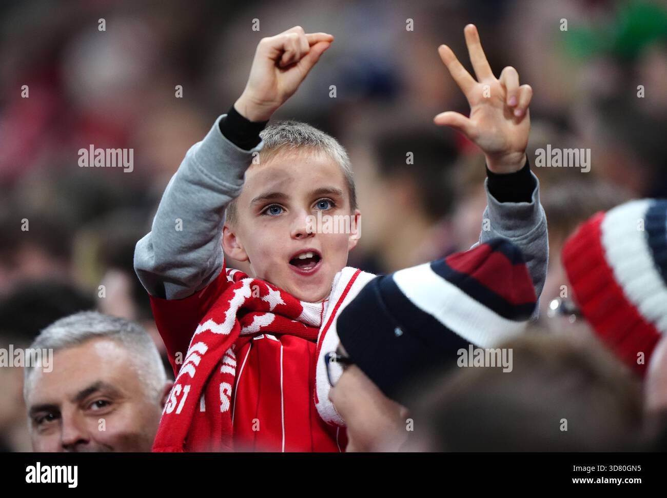 A young Nottingham Forest fan reminds the away fans of the score during ...
