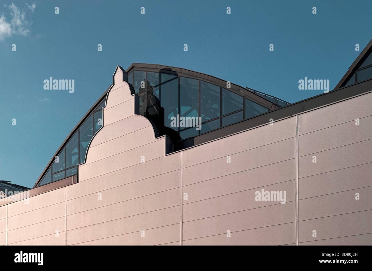 Sleek modern architecture with a curved glass roofline and clean facade ...