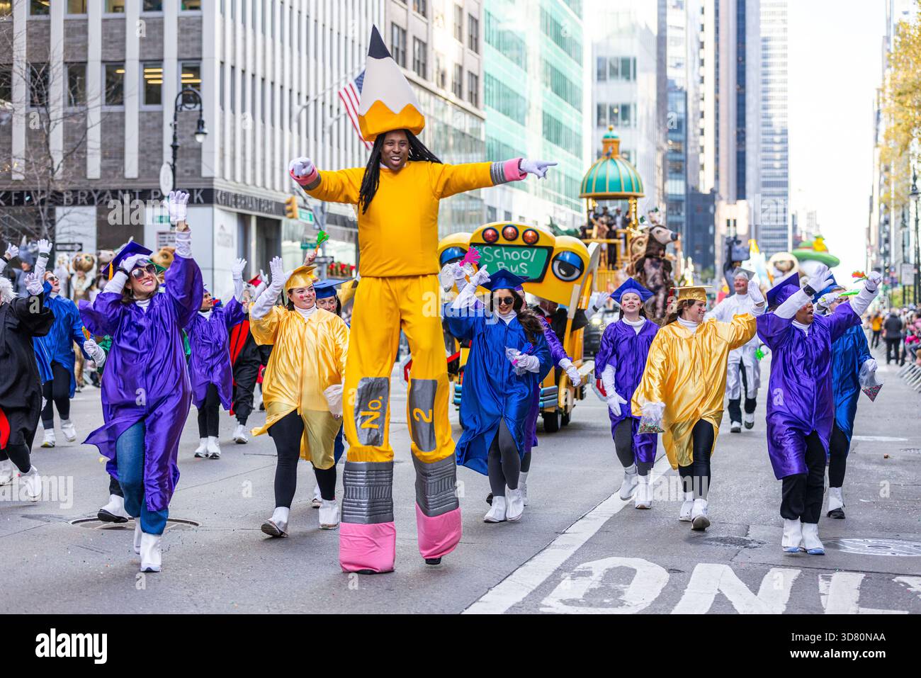 Participants in the 99th Annual Macy's Thanksgiving Day Parade wave to ...