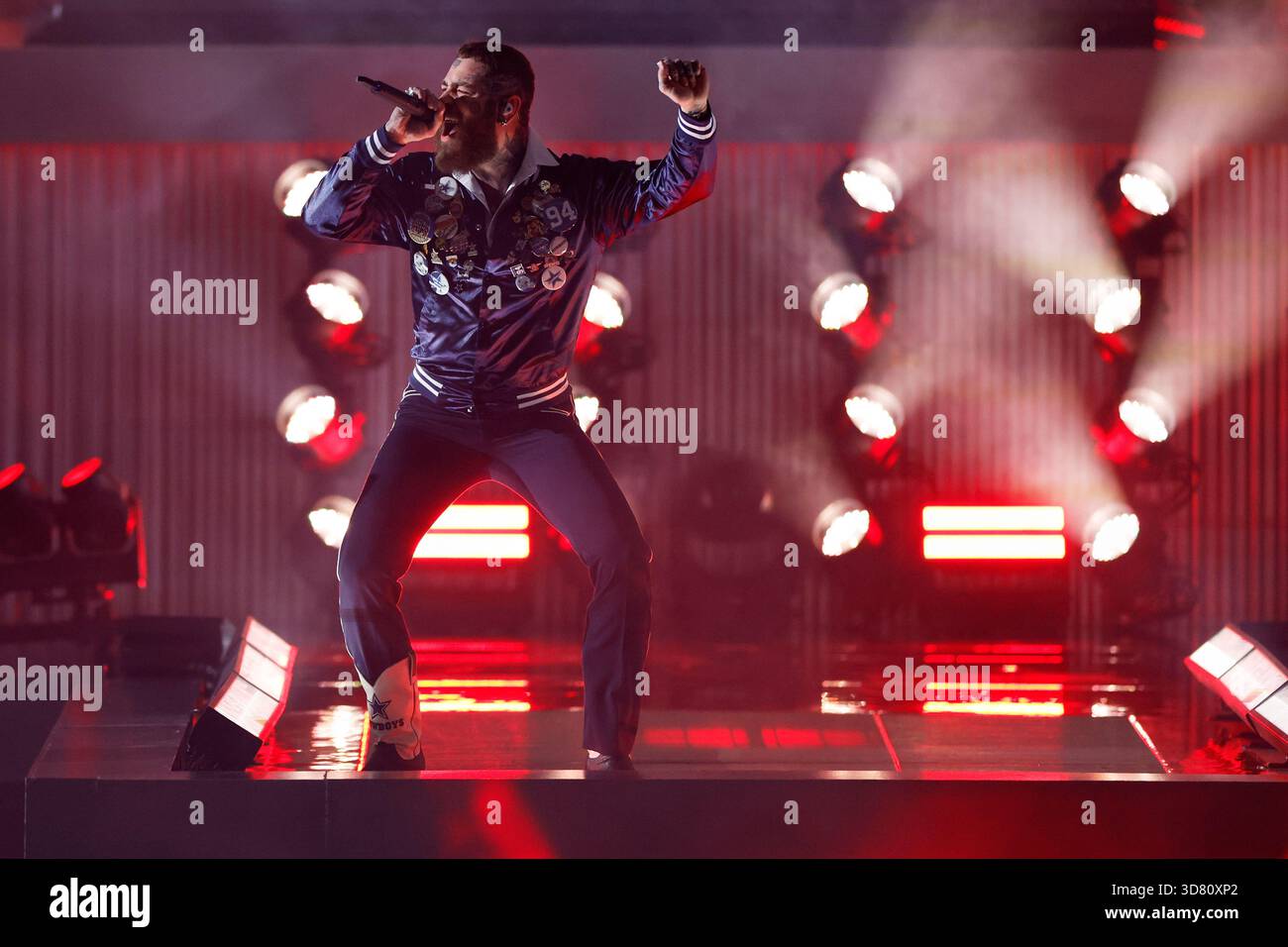 Post Malone performs during halftime of an NFL football game between ...
